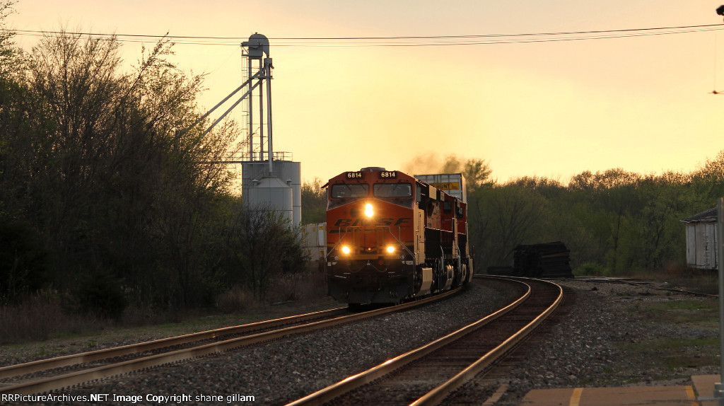 BNSF 6814 takes a eb stack train out of the sunlight.